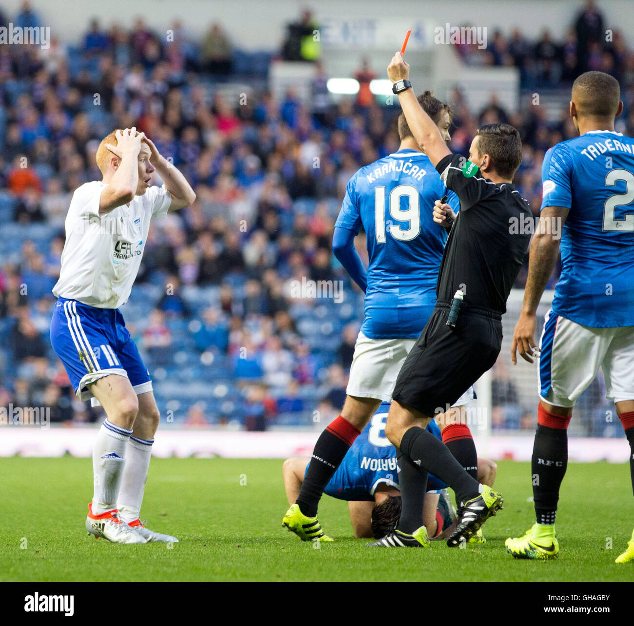 Peterhead's Nathan Blockley is shown a red card after a tackle on ...