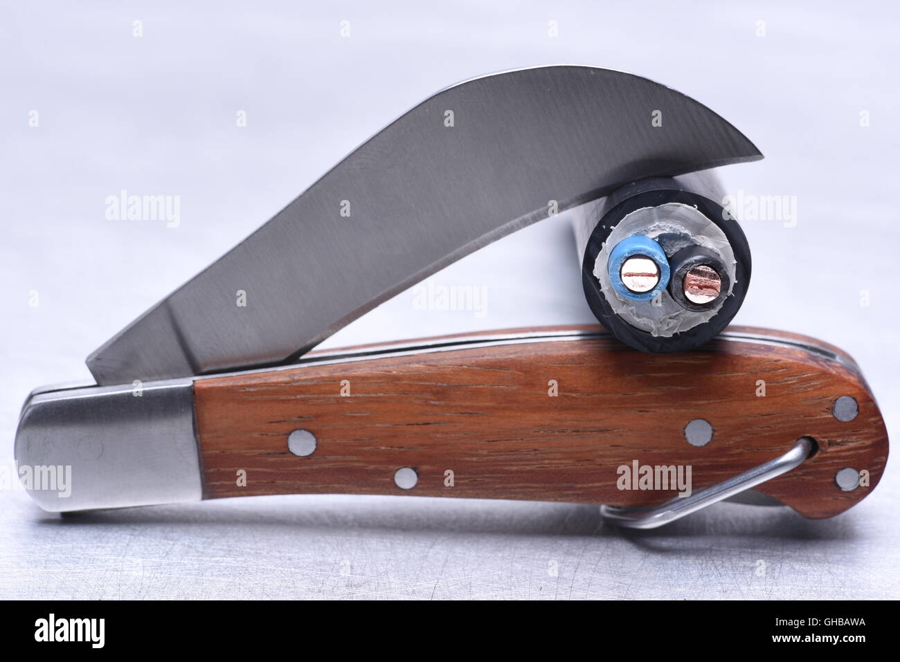 Utility knife tool with cable closeup Stock Photo - Alamy