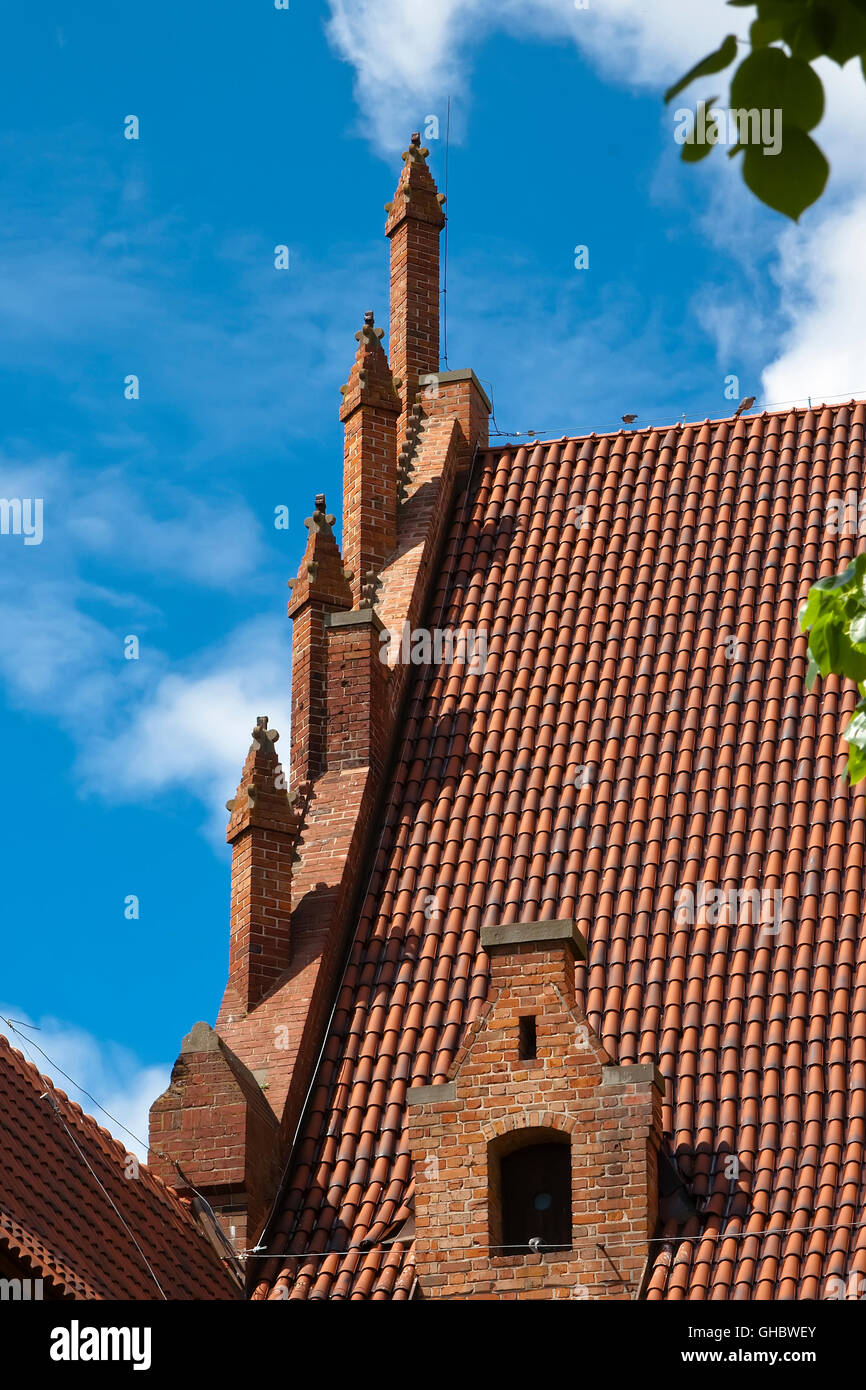 Roof tiles and decorations of a building in the middle replaced in ...