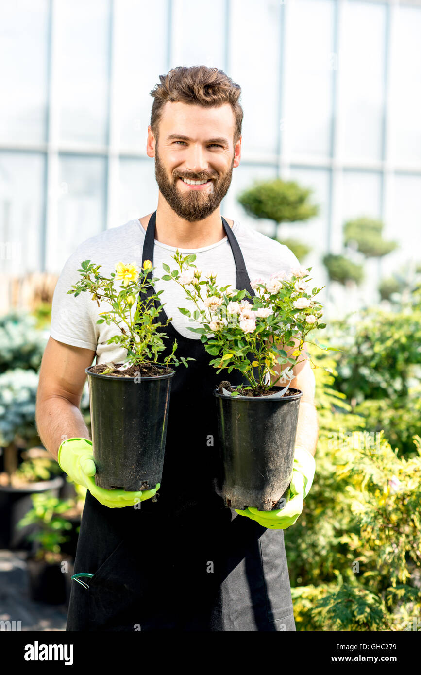 Gardener with a flowerpot Stock Photo - Alamy