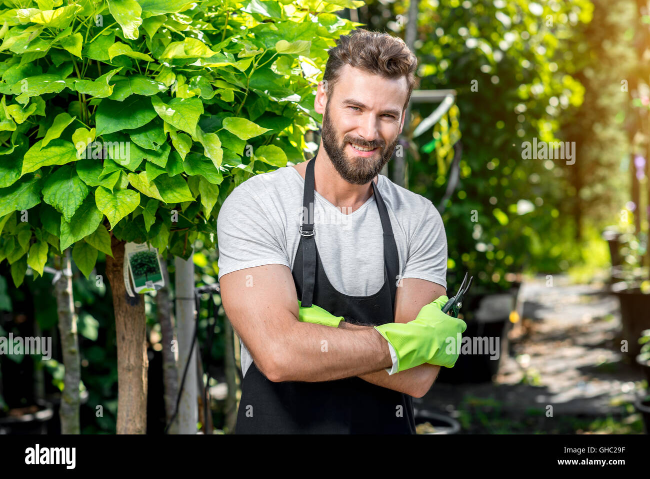 Portrait of handsome gardener Stock Photo - Alamy