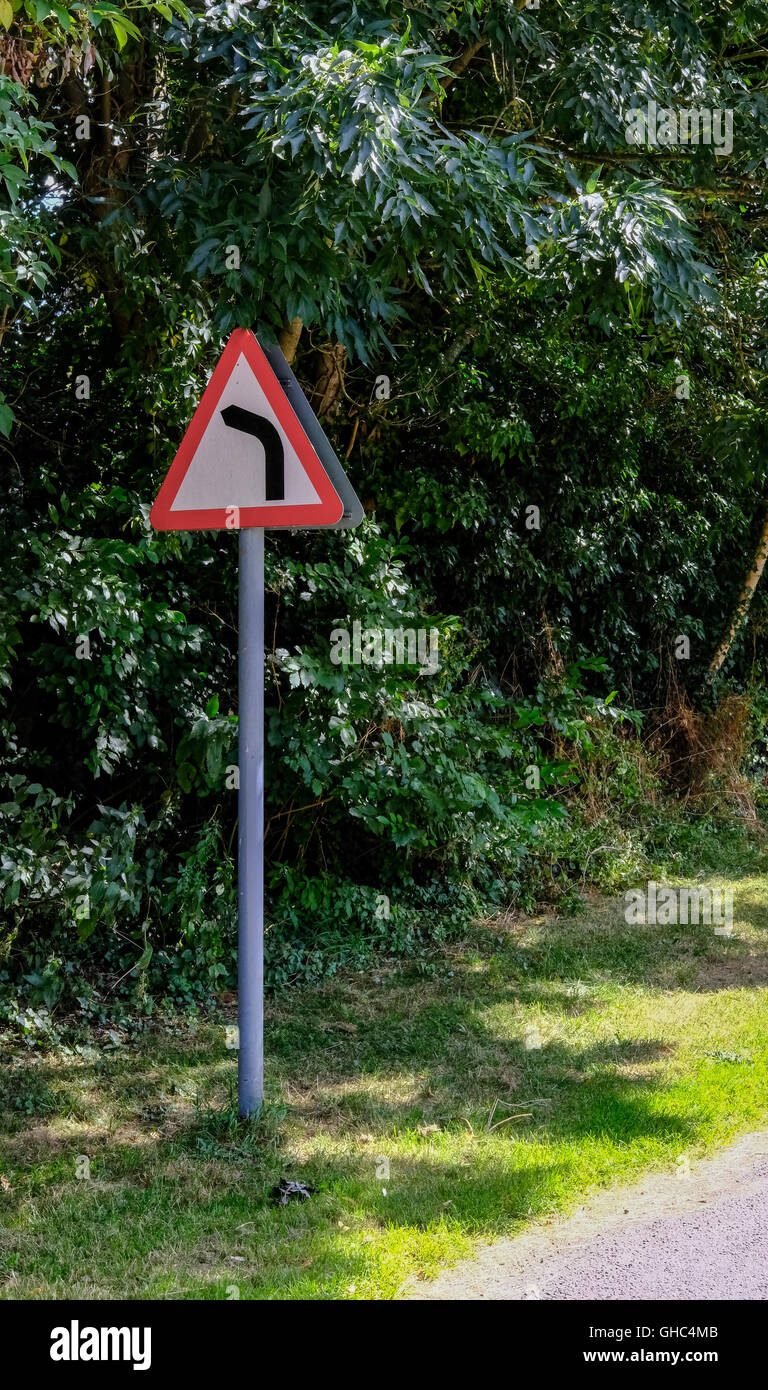 Standard road sign warning road users of a sharp bend to the left. As ...