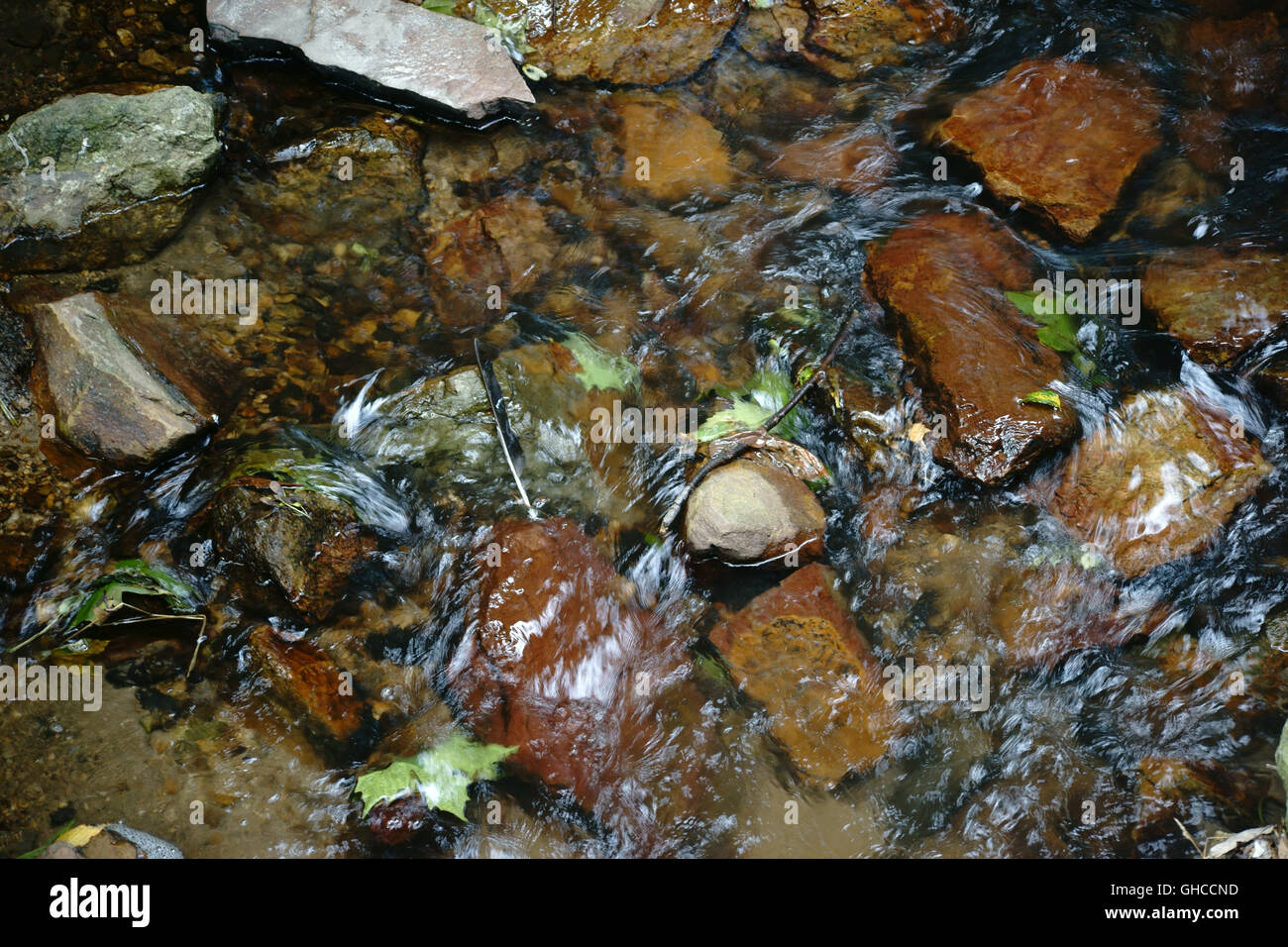 Flow with stones Stock Photo - Alamy