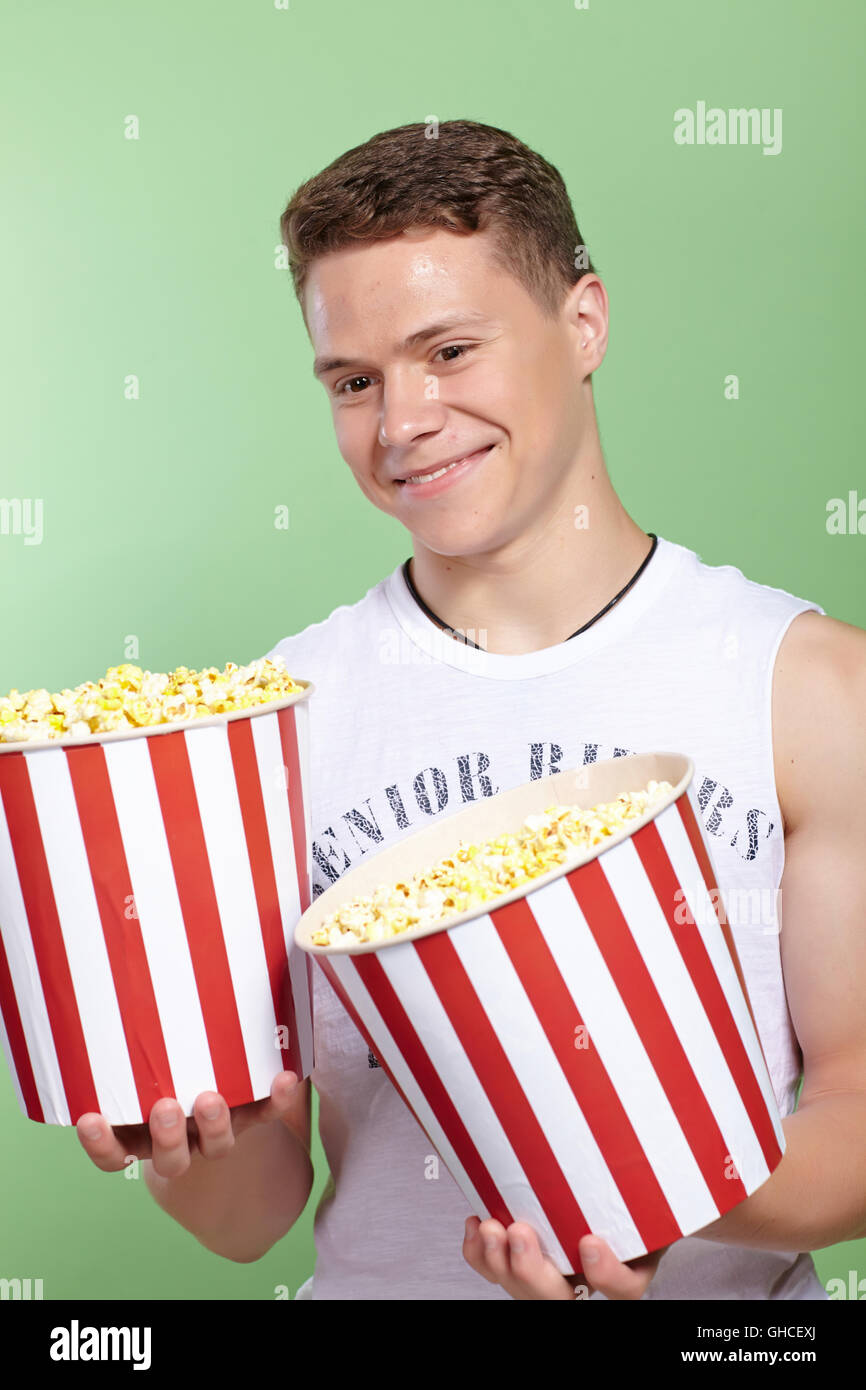 young man with popcorn Stock Photo - Alamy