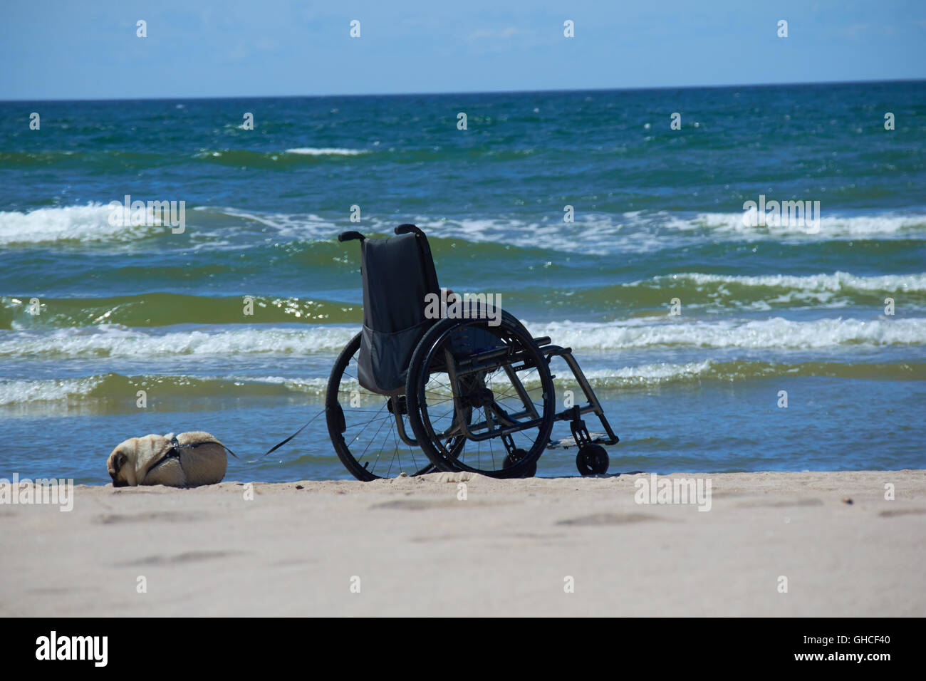 wheelchair on the beach Stock Photo - Alamy