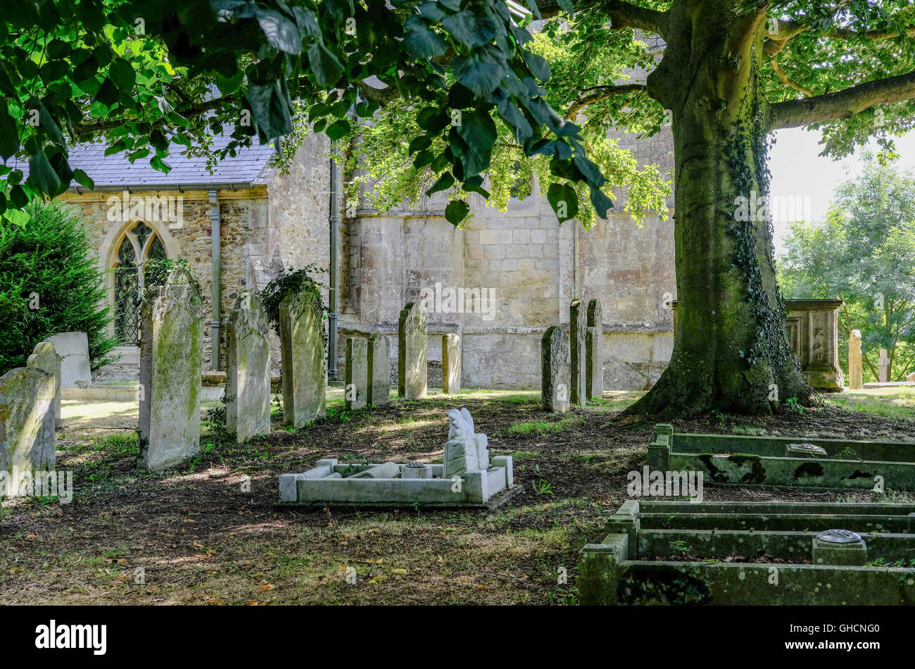 Summertime view of an ancient graveyard in England. Showing various ...