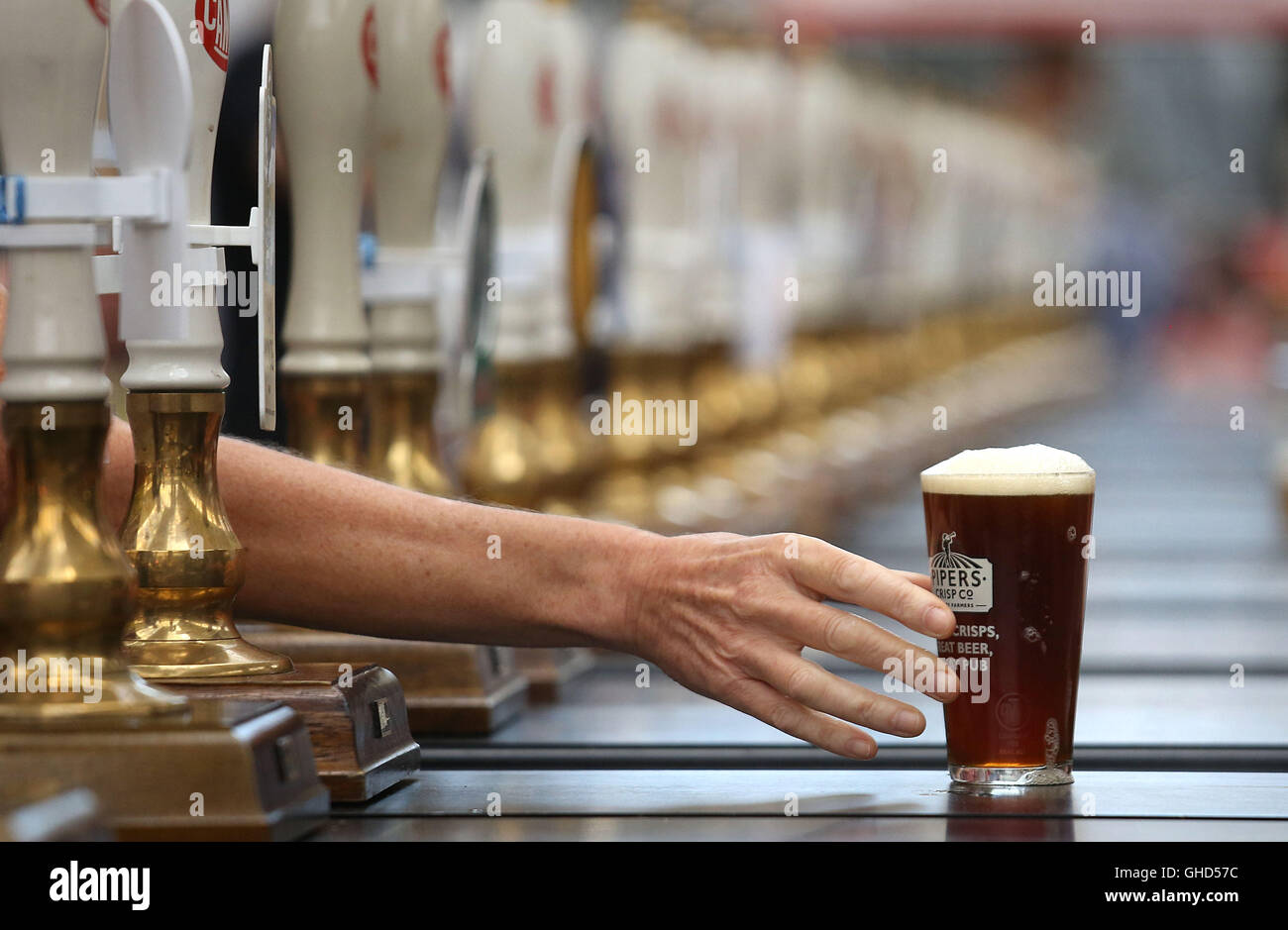 A pint of real ale is passed across one of the bars at the Great ...
