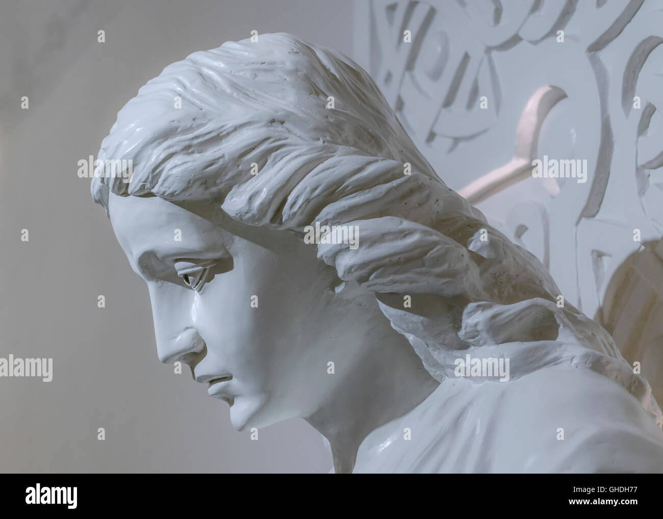 Close up side view of saint woman sculpture Stock Photo - Alamy