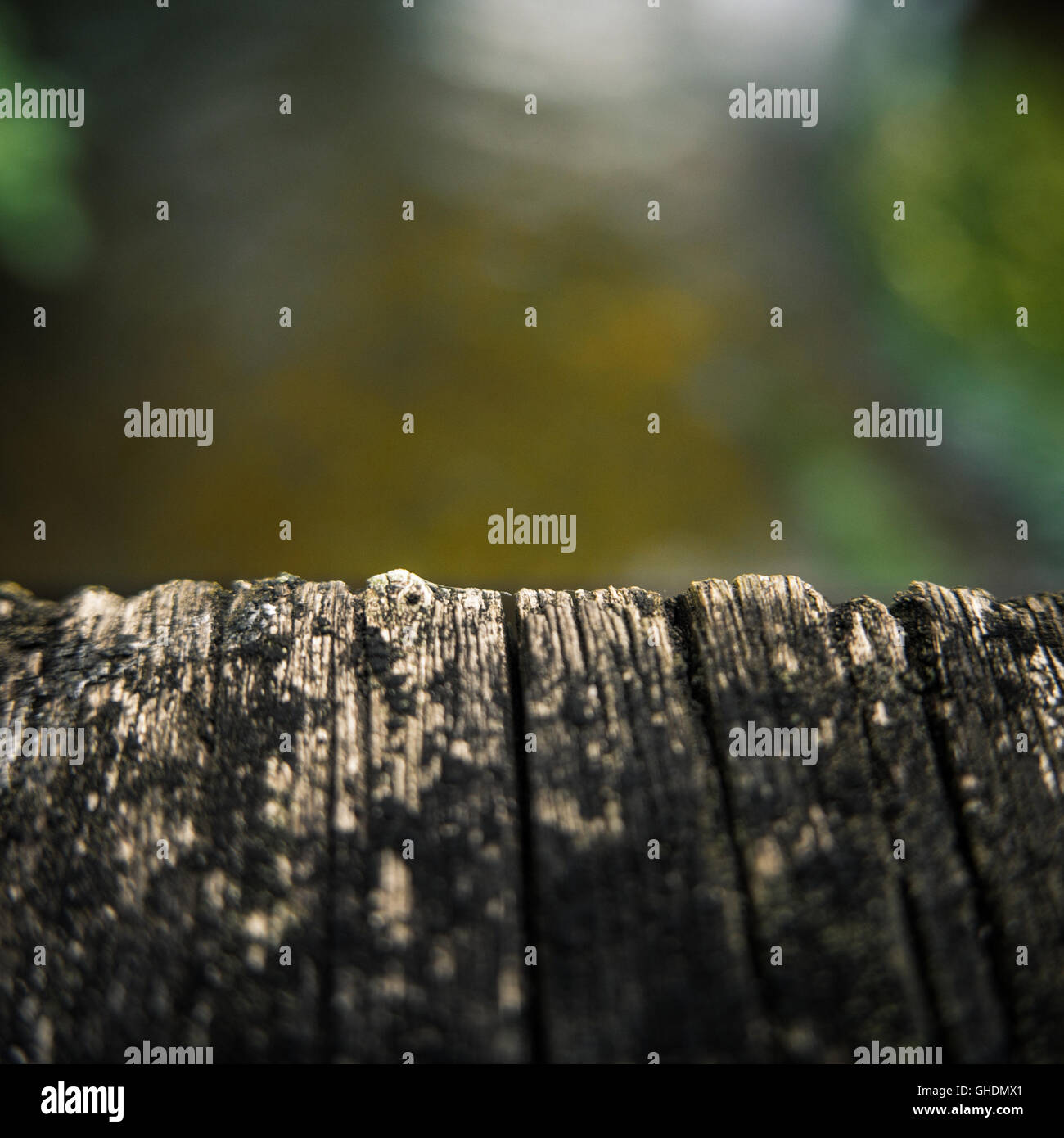 The Edge Of A Wooden Bridge Over A River Stock Photo - Alamy