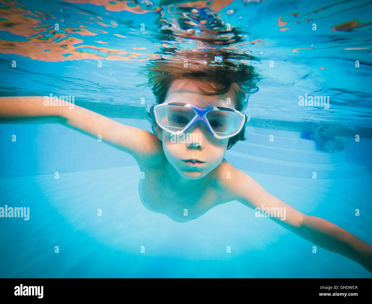 Portrait of boy swimming underwater in swimming pool Stock Photo - Alamy