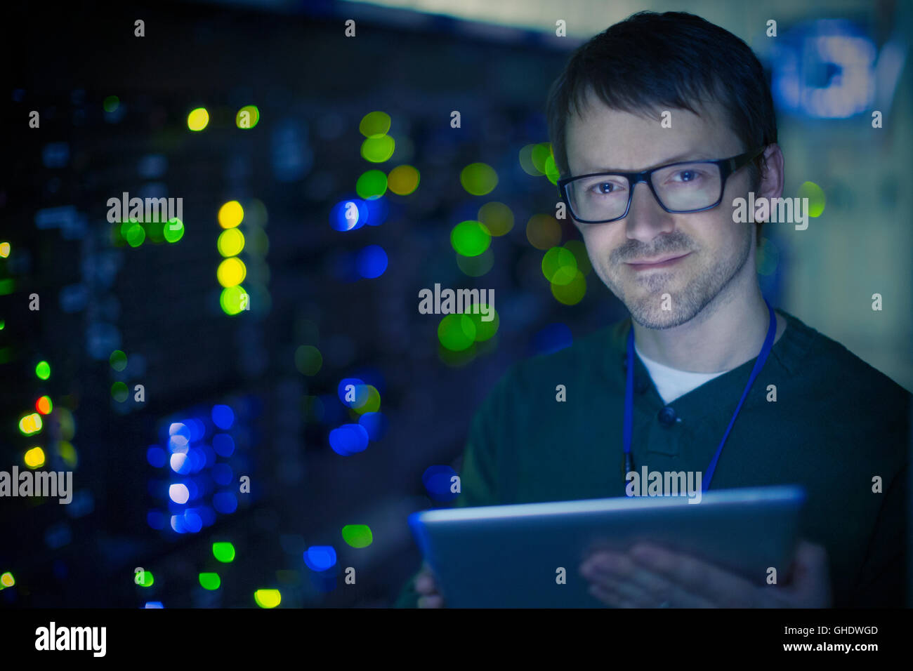 Portrait confident server room technician with digital tablet Stock ...