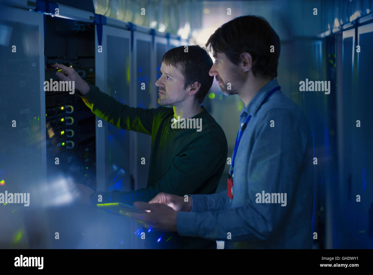 Server room technicians working on panel Stock Photo - Alamy