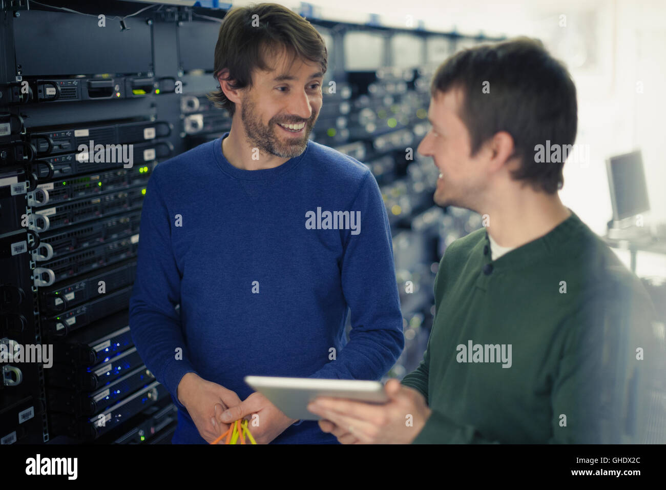 Server room technicians using digital tablet Stock Photo - Alamy