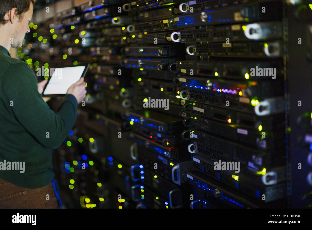 Server room technician using digital tablet at panel Stock Photo - Alamy