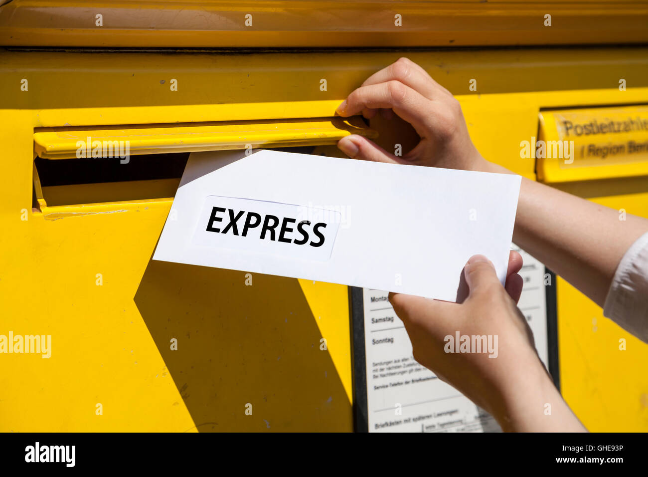 "Express" letter into mailbox Stock Photo - Alamy