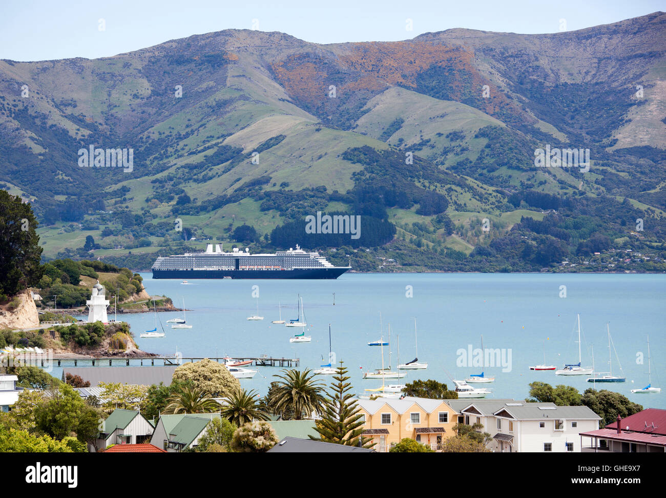 The view of a cruise ship in Glen Bay and Akaroa resort town (New ...