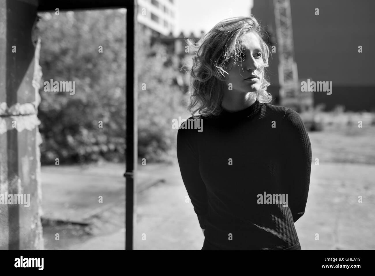 Beautiful woman with a serious expression on her face looking straight ...