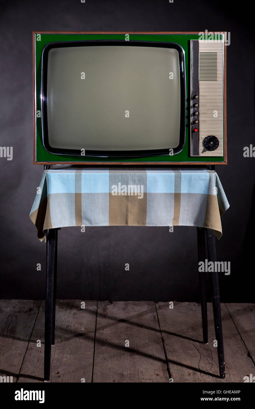 Vintage green TV, at the table with blue checkered tablecloth Stock ...