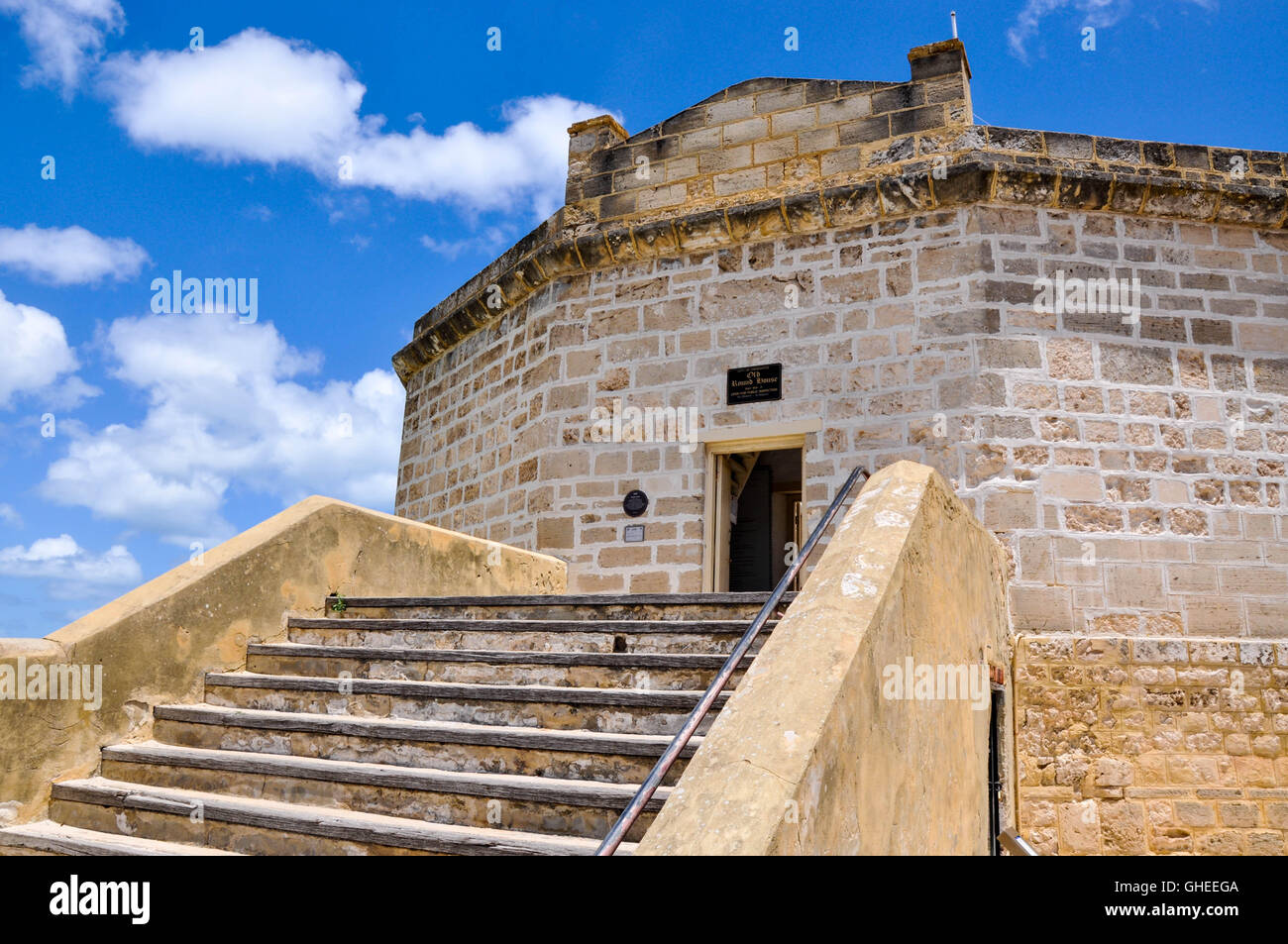 The old 12-sided historic limestone brick prison Round House building ...