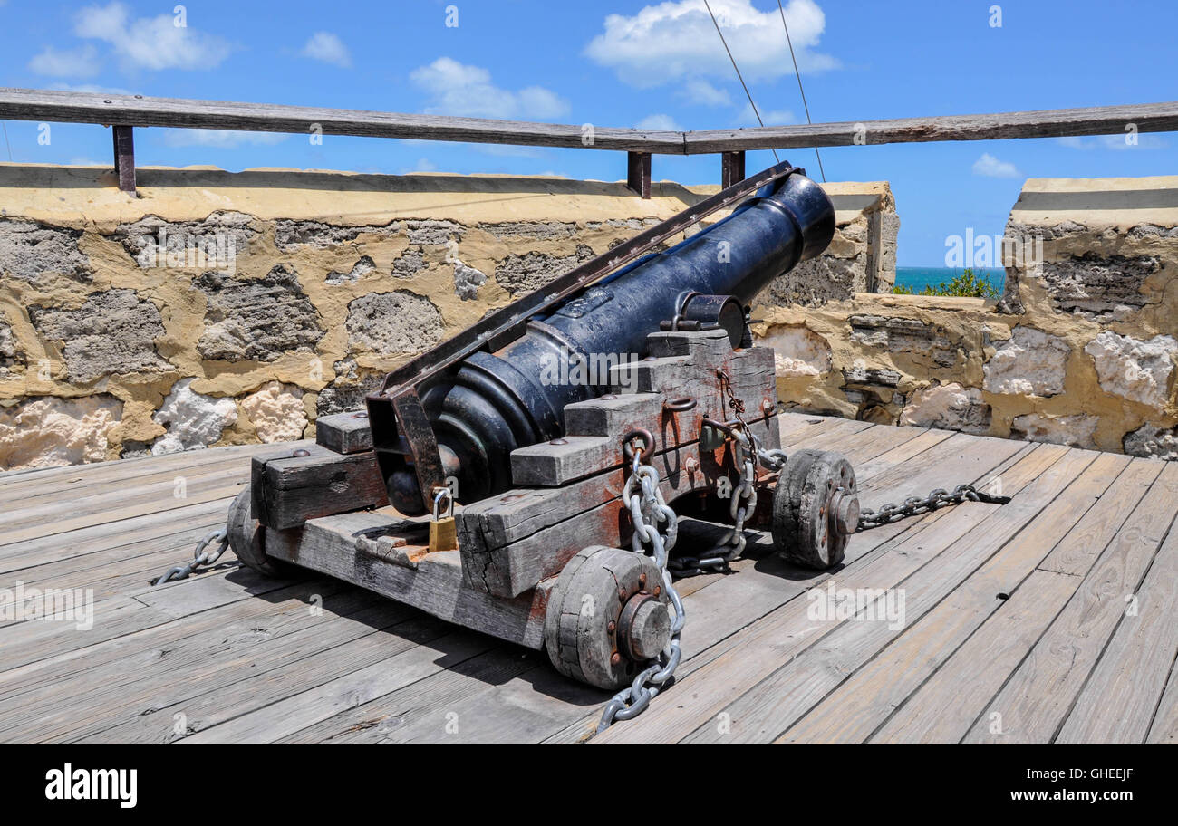Old replica black cannon on mount on balcony decking at the Round House ...