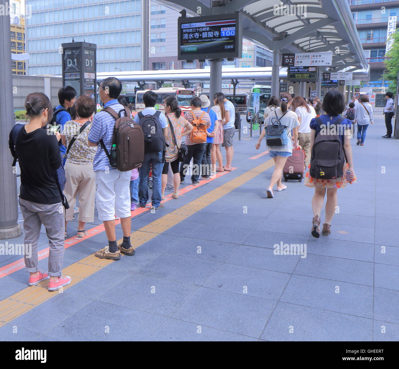 People queue at Kyoto station bus terminal in Kyoto Japan Stock Photo ...
