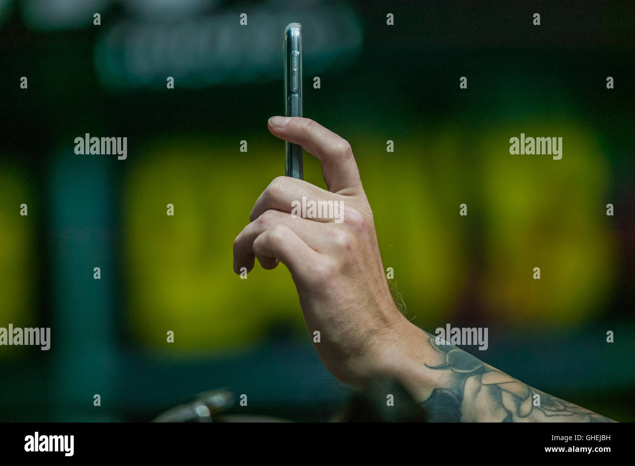 Hand holding Mobile phone taking a selfie Stock Photo - Alamy