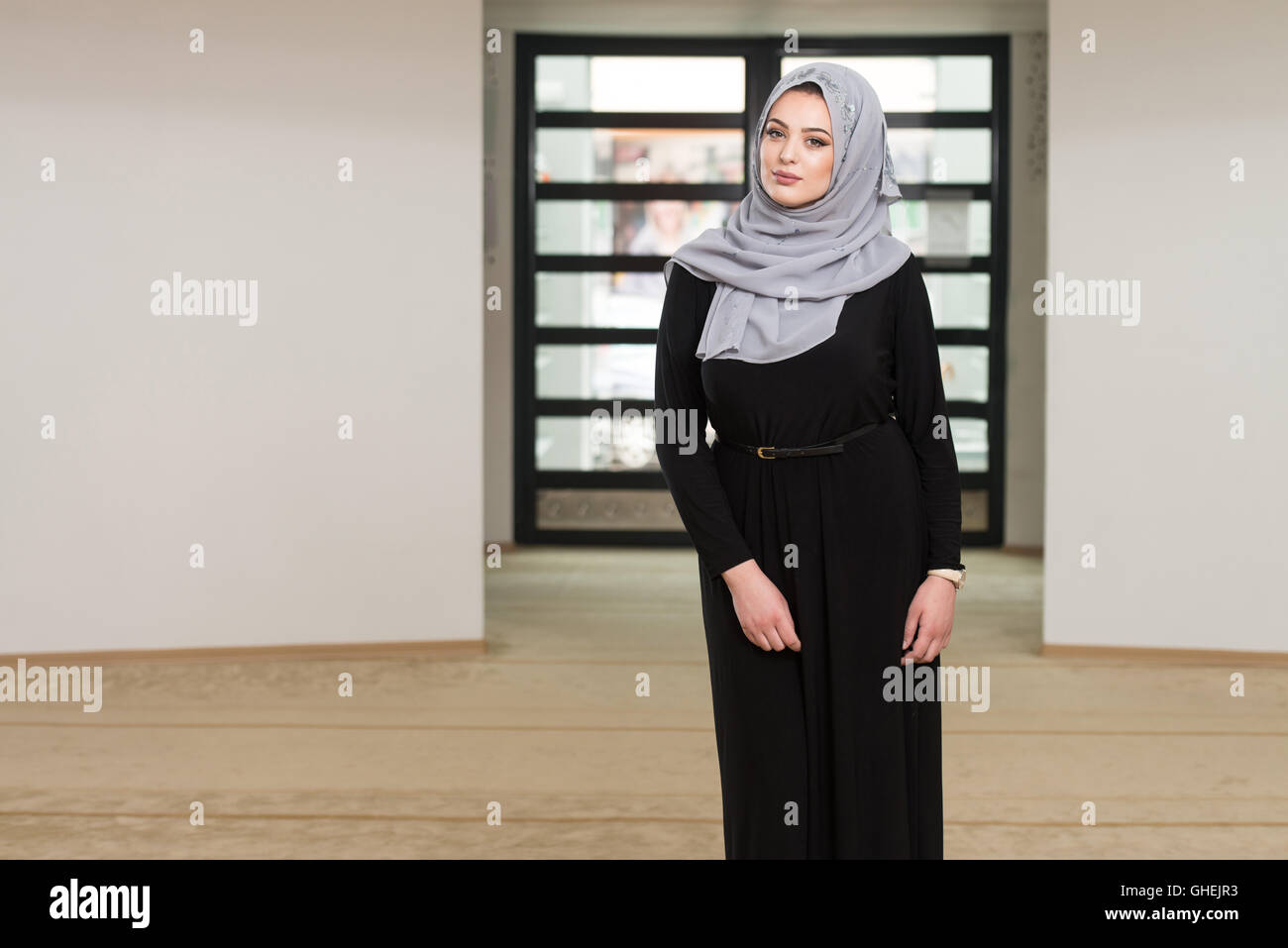 Young Muslim Woman Making Traditional Prayer To God While Wearing A ...
