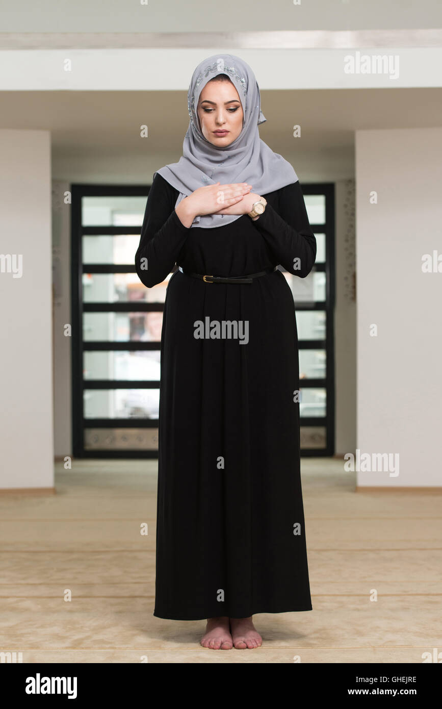 Muslim woman making traditional prayer hi-res stock photography and ...