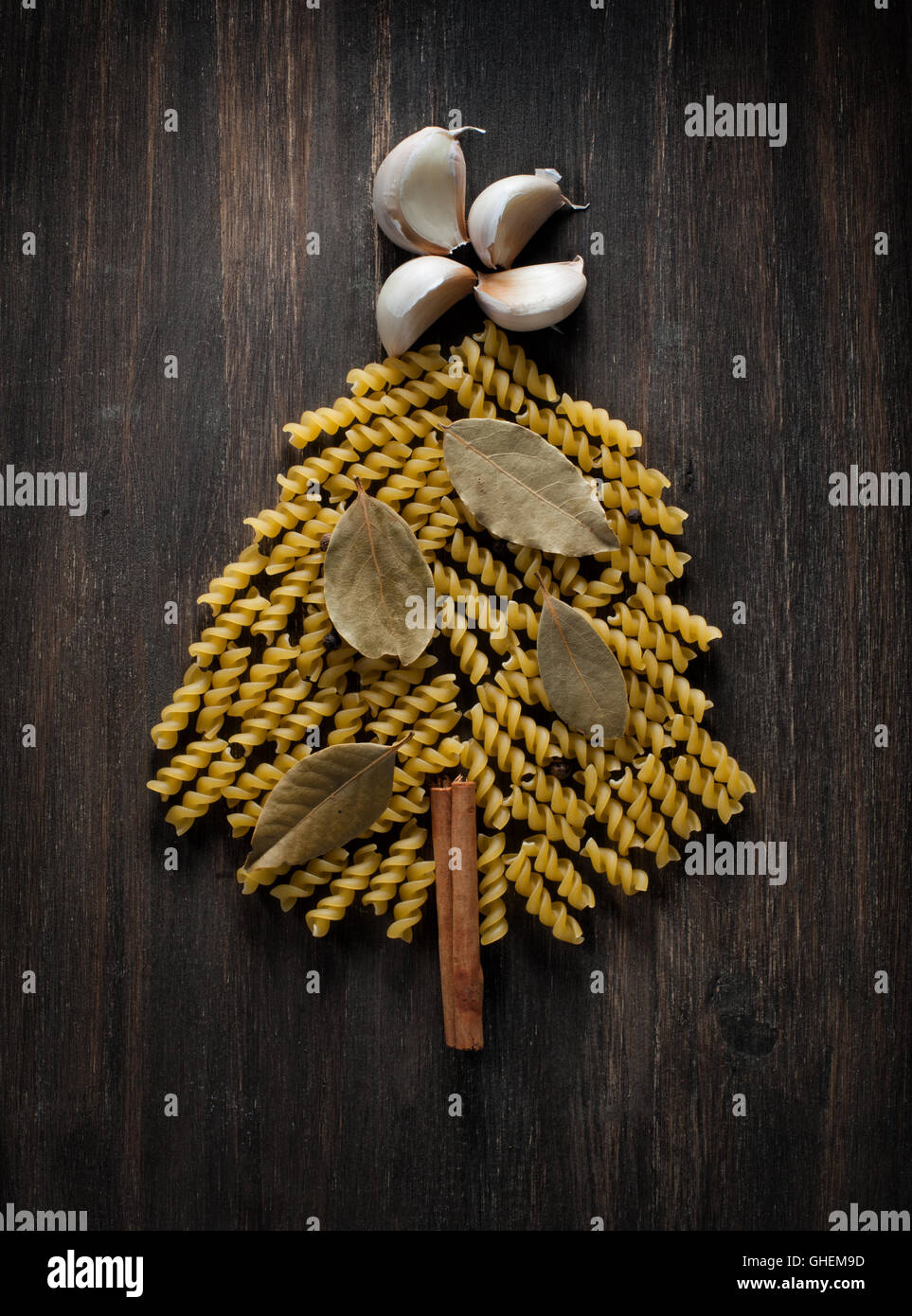 Christmas tree of pasta on the wooden background Stock Photo - Alamy
