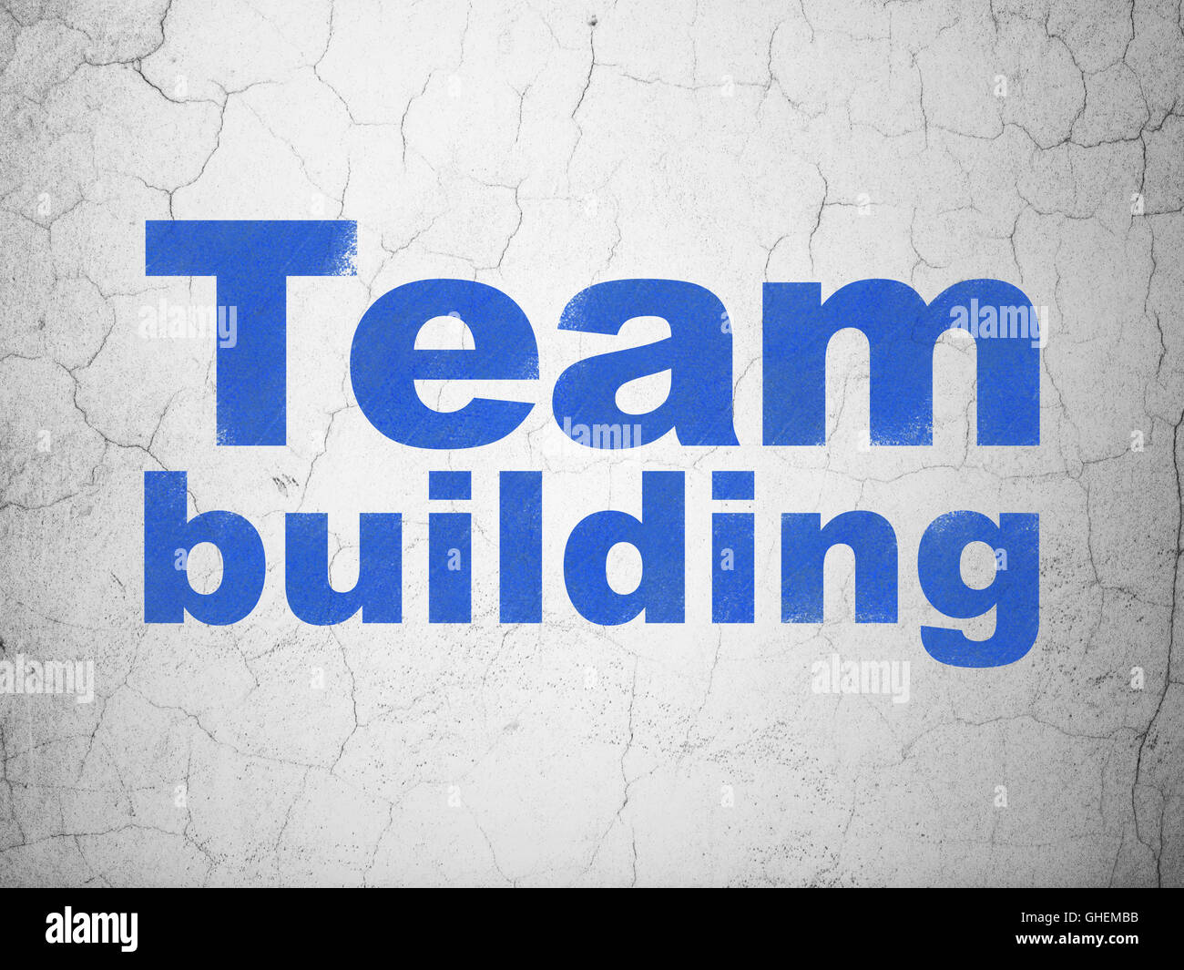 Finance concept: Team Building on wall background Stock Photo - Alamy