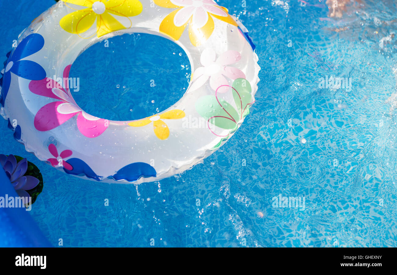 Inflatable swimming circle in open air pool in summer day Stock Photo ...