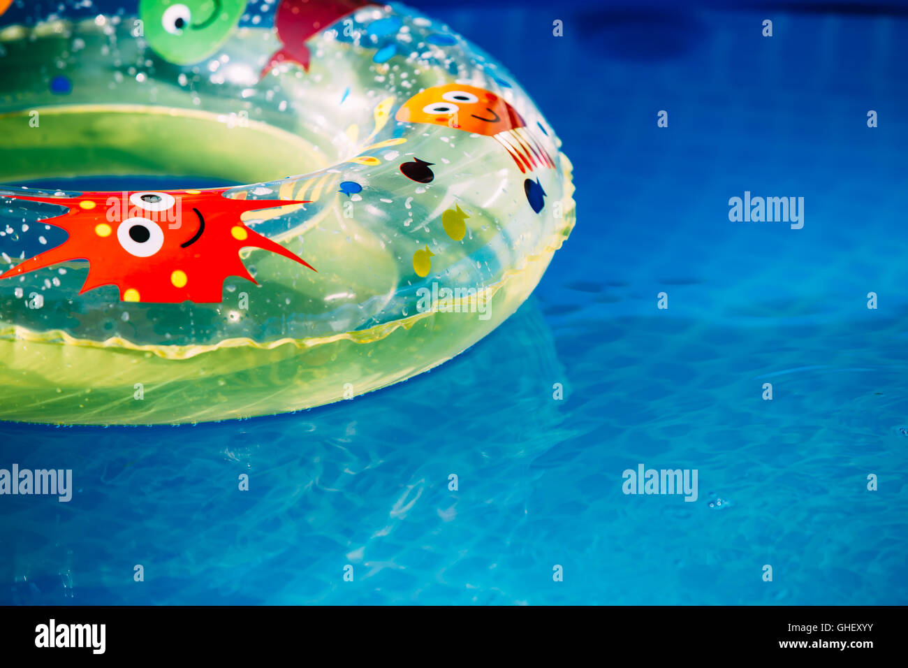 Inflatable swimming circle in open air pool in summer day Stock Photo ...