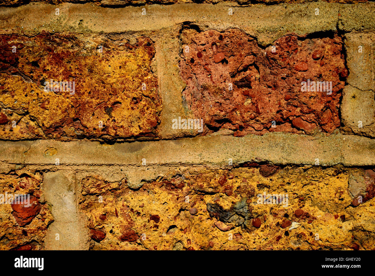 Close up detail of yellow and red brick wall Stock Photo - Alamy