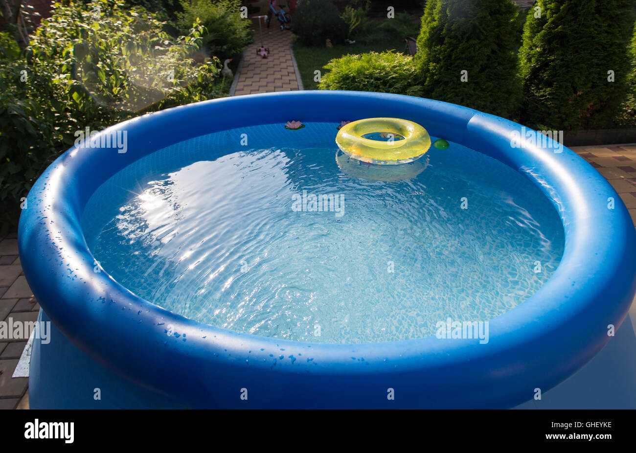 Outdoor blue inflatable pool with water Stock Photo - Alamy