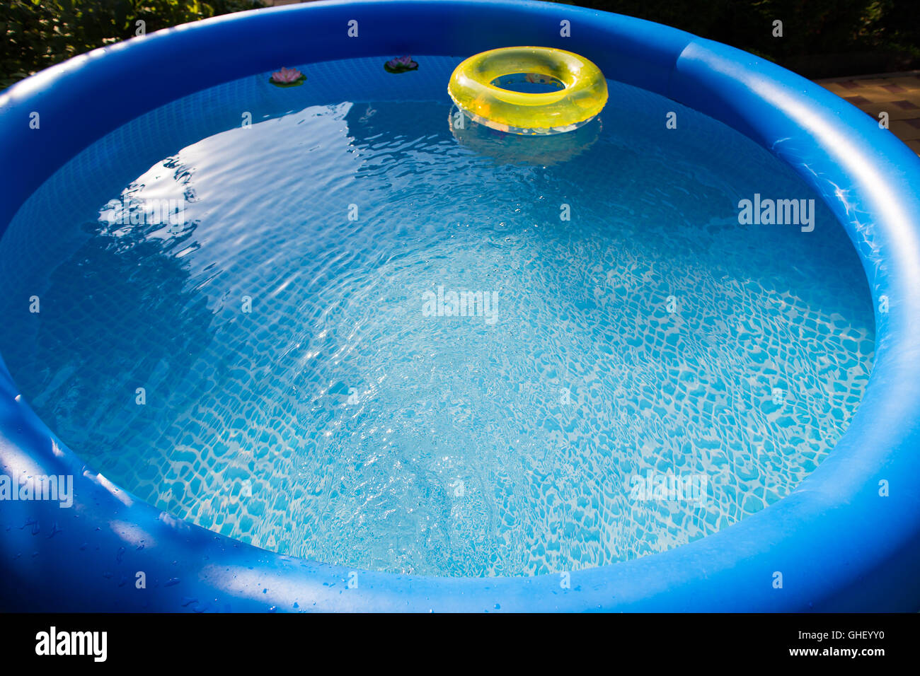 Outdoor blue inflatable pool with water Stock Photo - Alamy