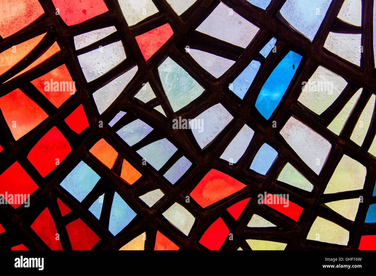 Image of a multicolored stained glass window with irregular block ...