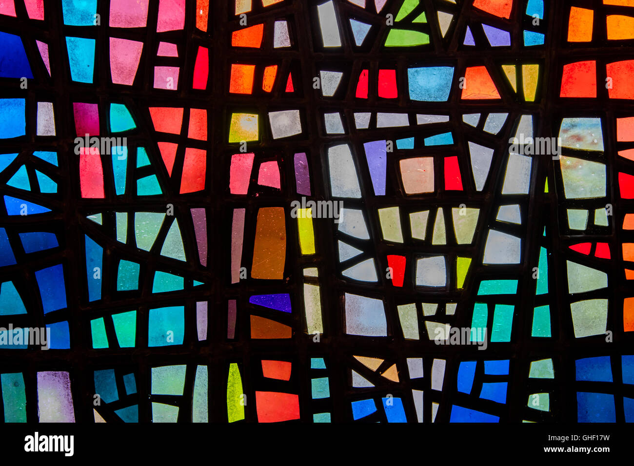 Image of a multicolored stained glass window with irregular block ...