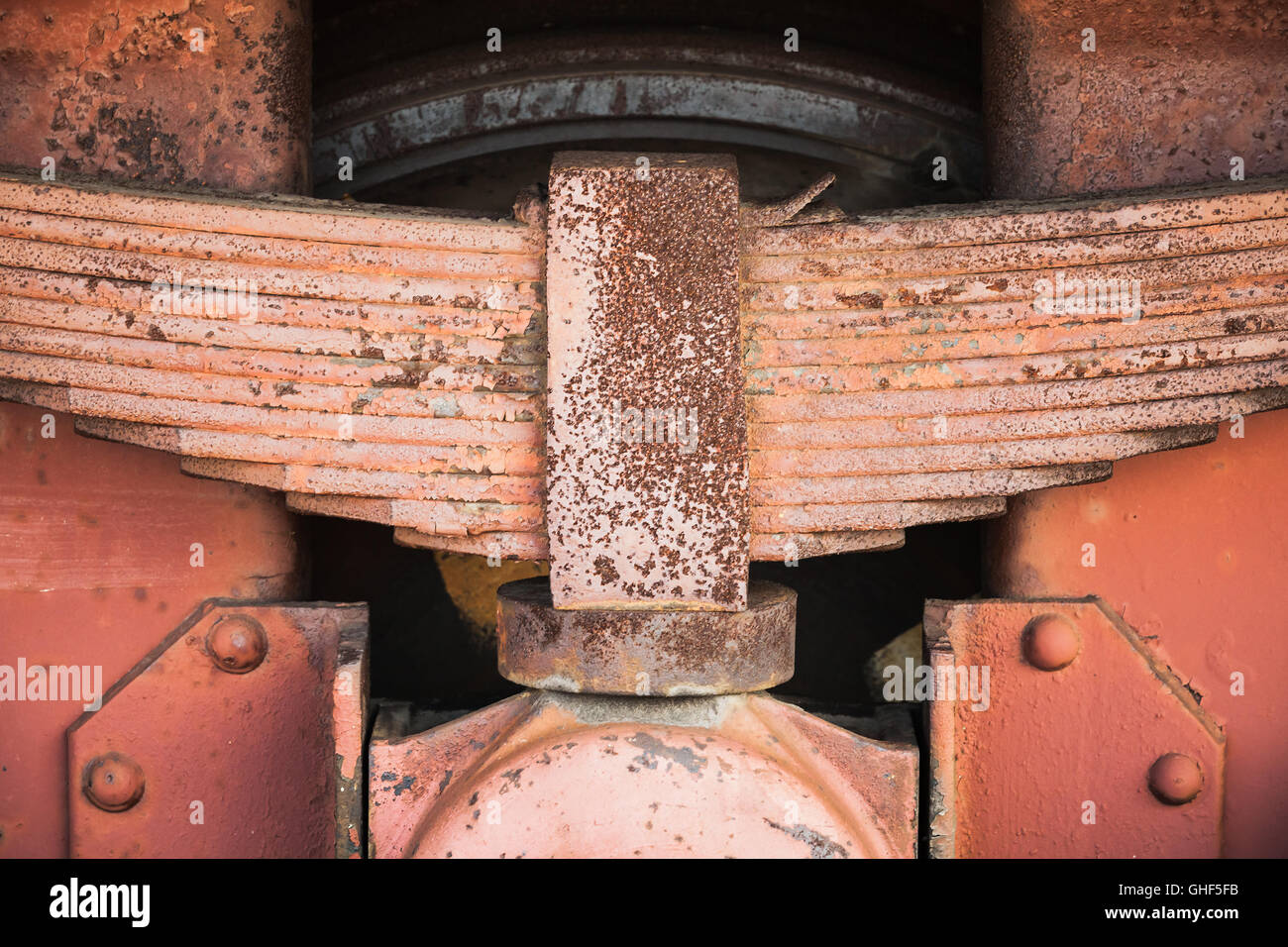 Red rusted leaf spring of industrial railway carriage, close up photo ...