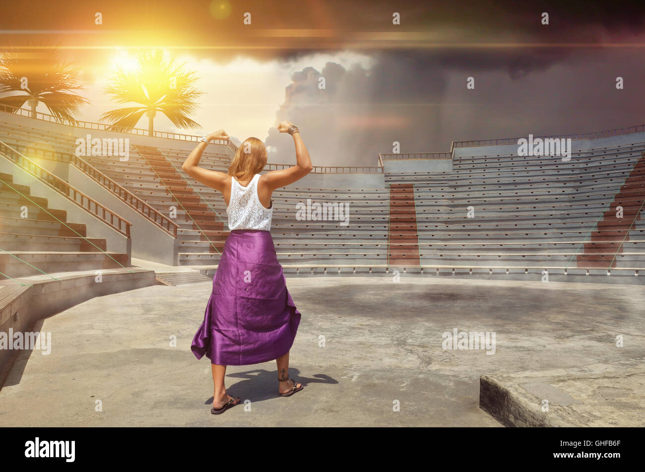 Strong young woman enters an arena with the sake of winning - career ...