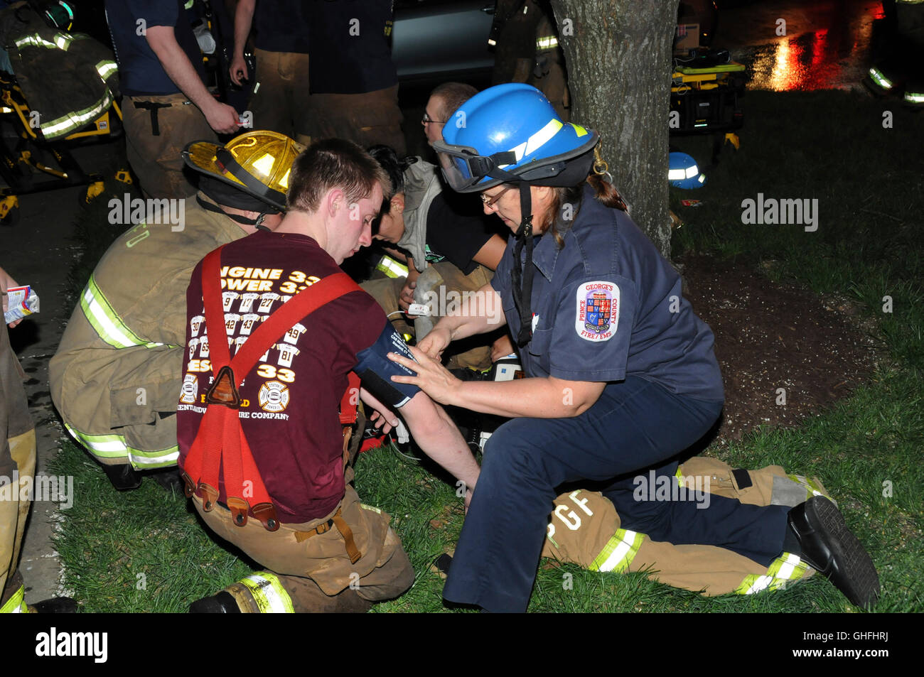 Medics check on firefighters battling a 2 alarm fire in Greenbelt ...