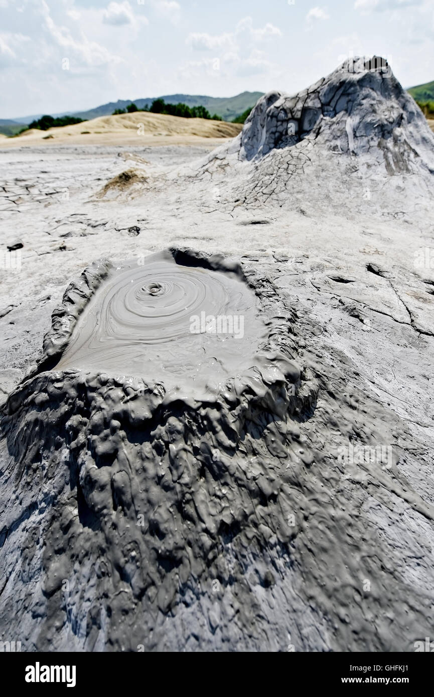 Landscape with mud volcanoes also known as mud domes erupting in summer ...
