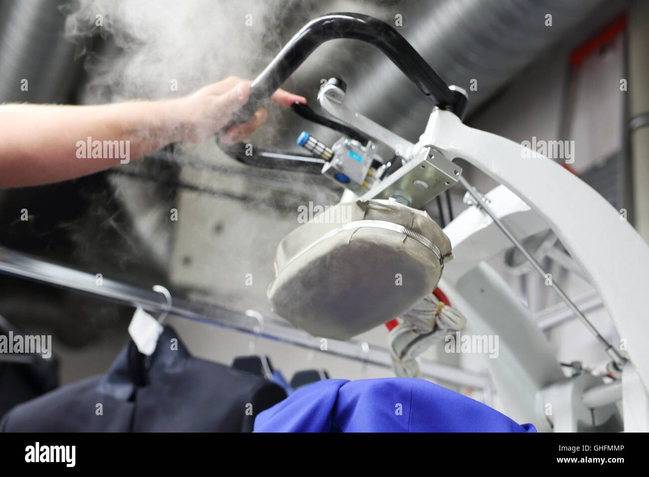 Clothing industry. Ironing steam Stock Photo - Alamy