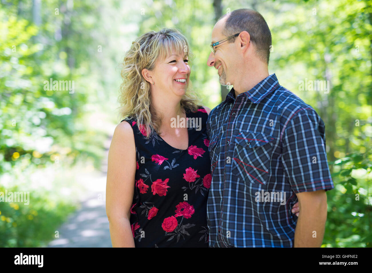 Happy adult couple in park Stock Photo - Alamy