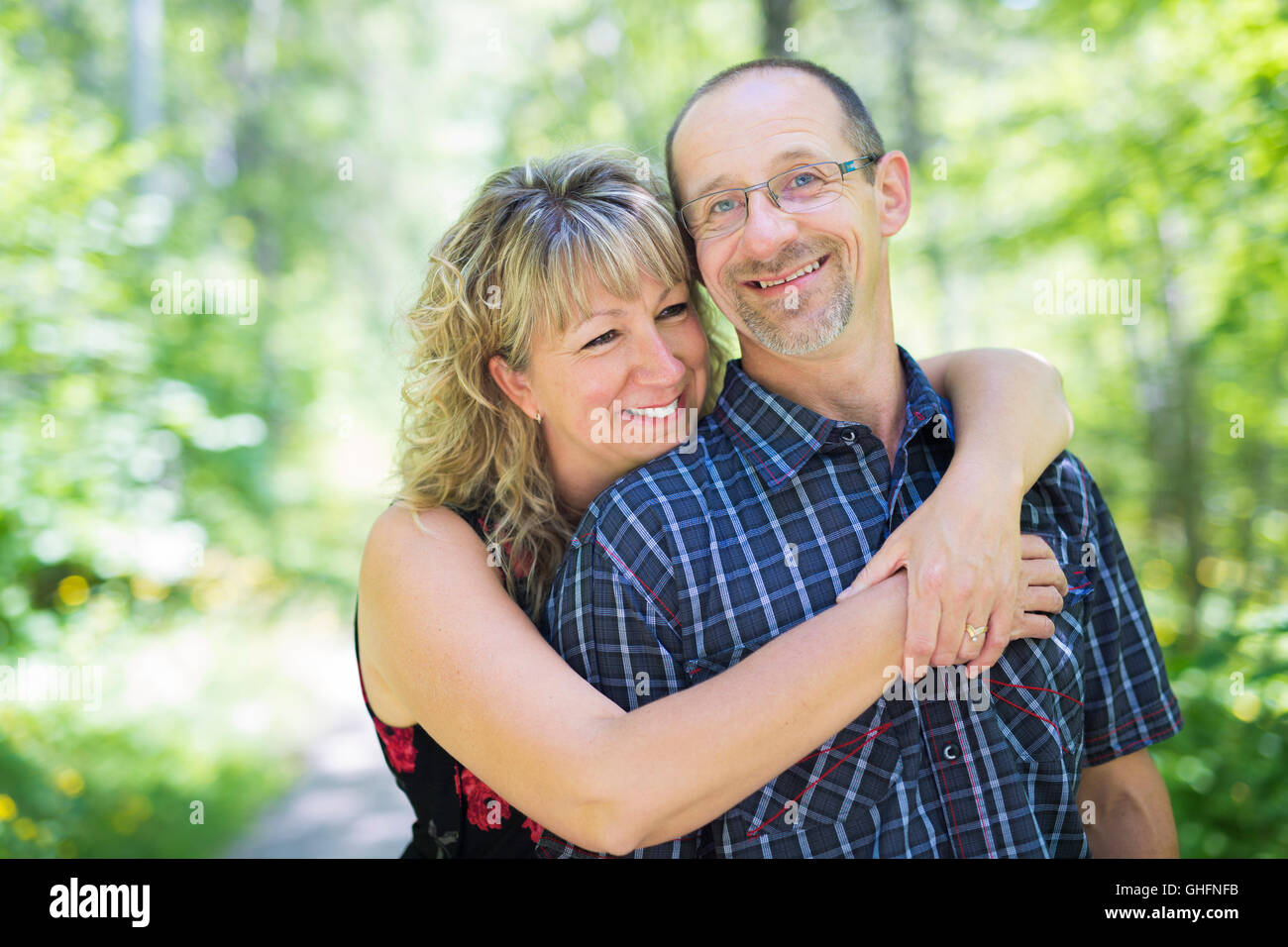 Happy adult couple in park Stock Photo - Alamy