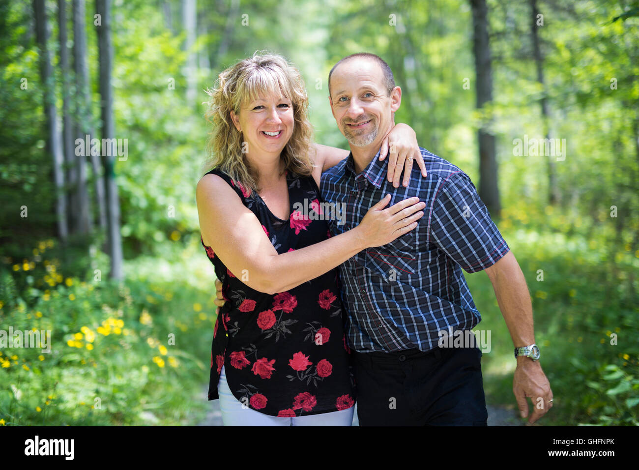 Happy adult couple in park Stock Photo - Alamy