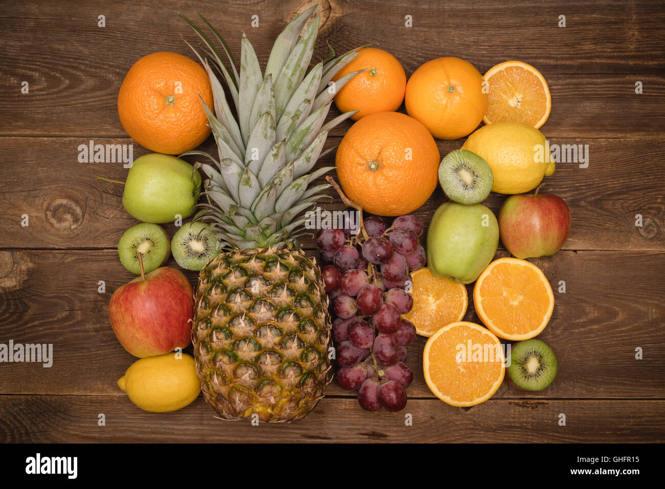Tasty fruit background with orange, kiwi, grape, apples and lemon on ...