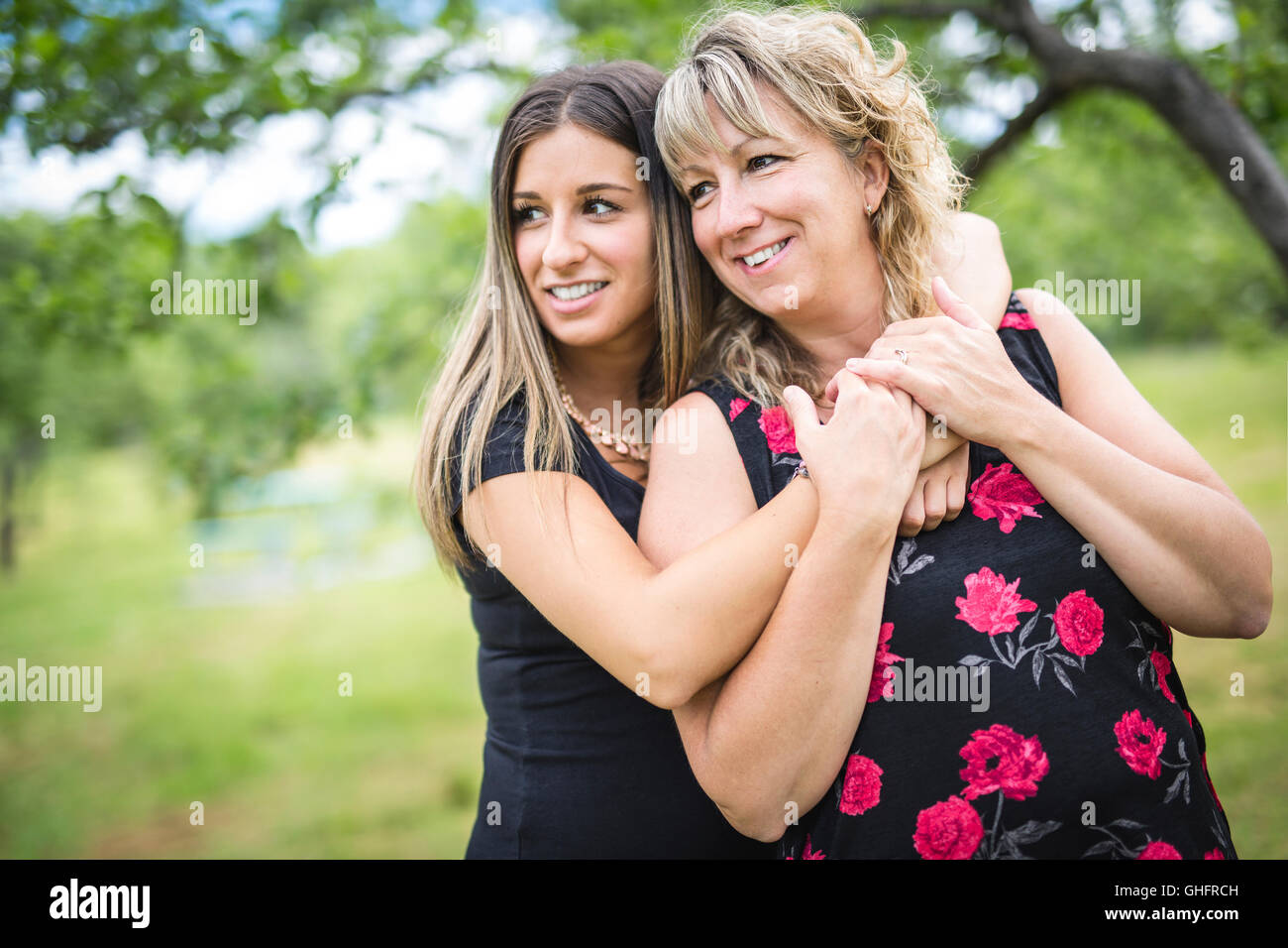 adult mother and daughter outside in forest Stock Photo - Alamy