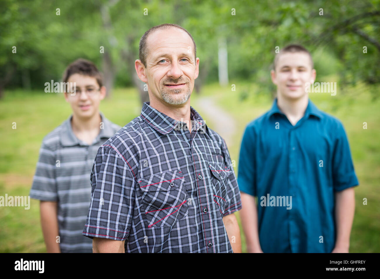 Portrait of happy father and teenager boy outdoor Stock Photo - Alamy