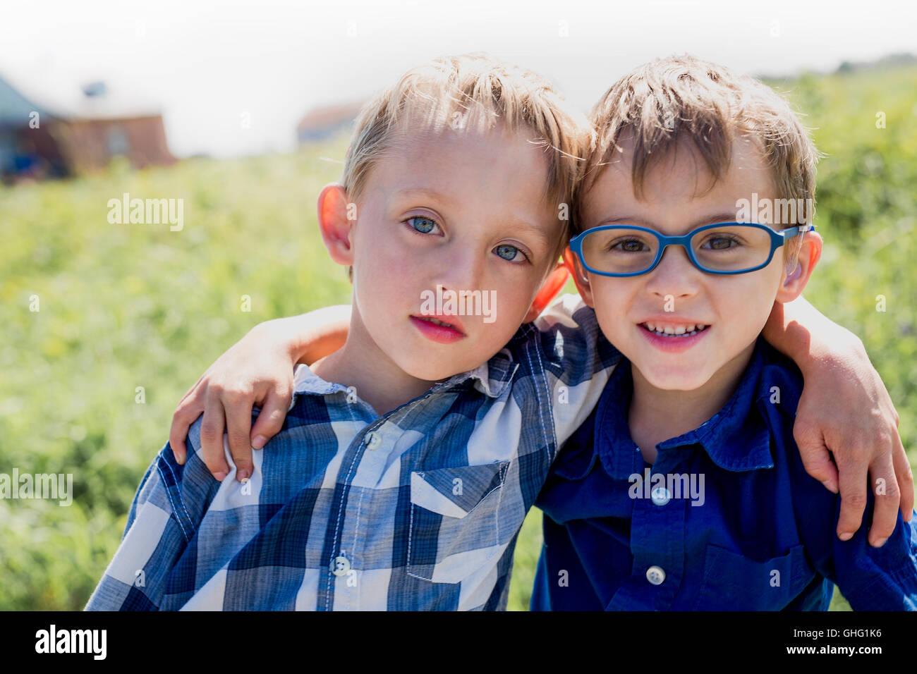 Two Children Together In field Stock Photo - Alamy
