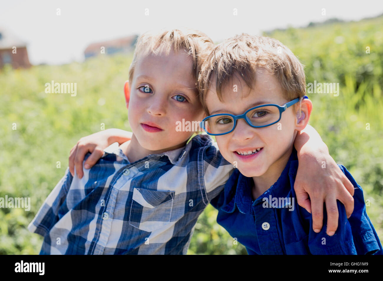 Two Children Together In field Stock Photo - Alamy